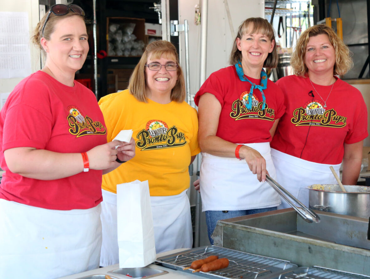 Counselor dips dogs during summer